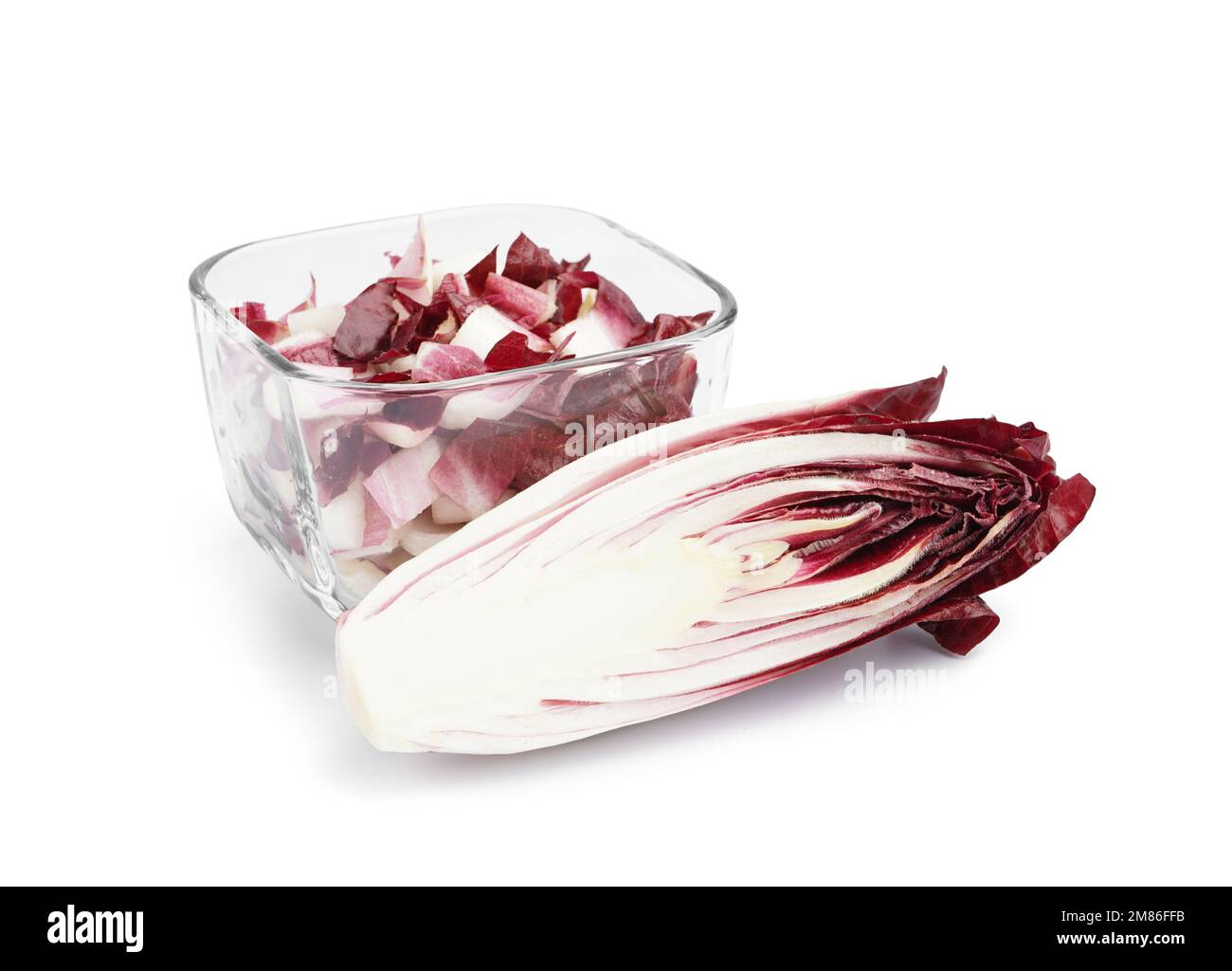 Glass bowl of cut red endive on white background Stock Photo - Alamy
