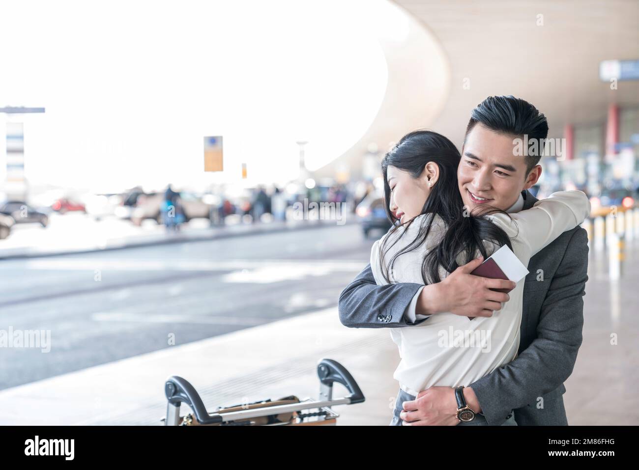 Two friends hug airport hi-res stock photography and images - Alamy