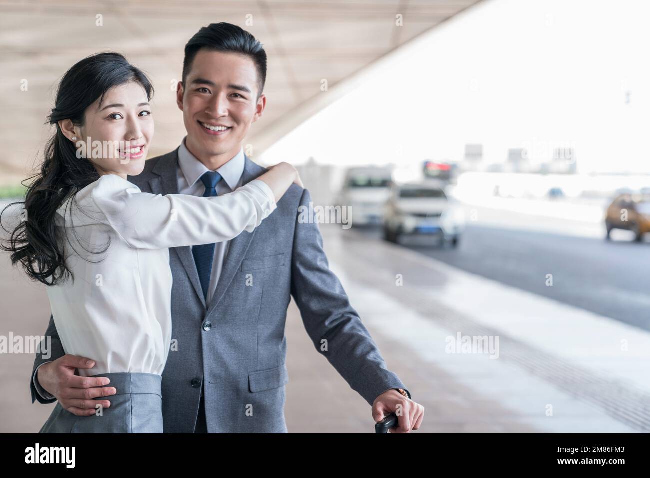 Two friends hug airport hi-res stock photography and images - Alamy