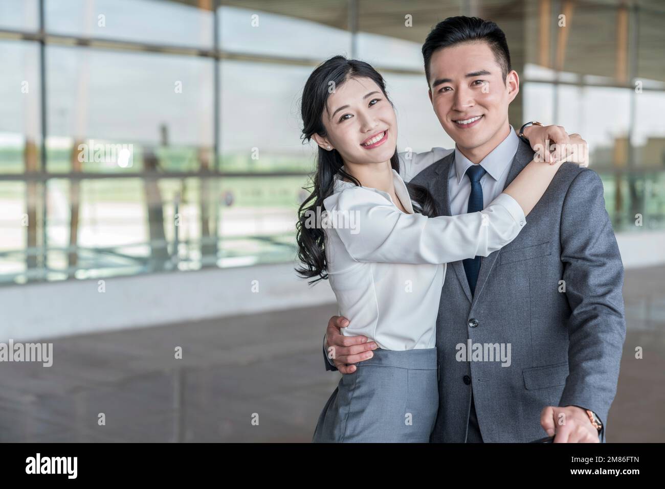 Two friends hug airport hi-res stock photography and images - Alamy
