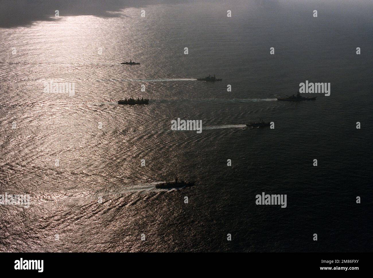 Aerial view of various U.S. Navy ships underway in formation. The ...