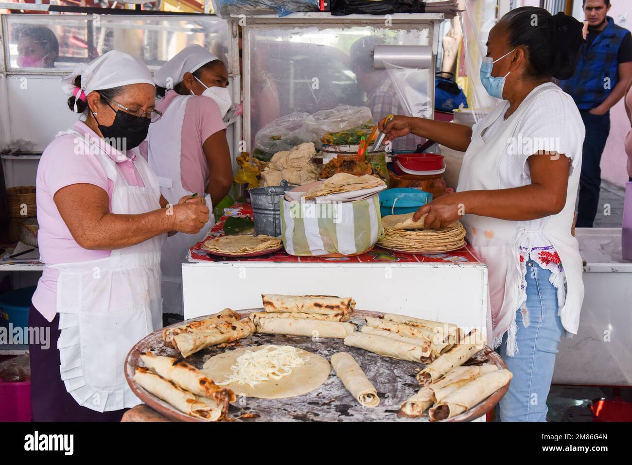 Women working at a food stall selling Tlayudas, Oaxaca Mexico Stock ...