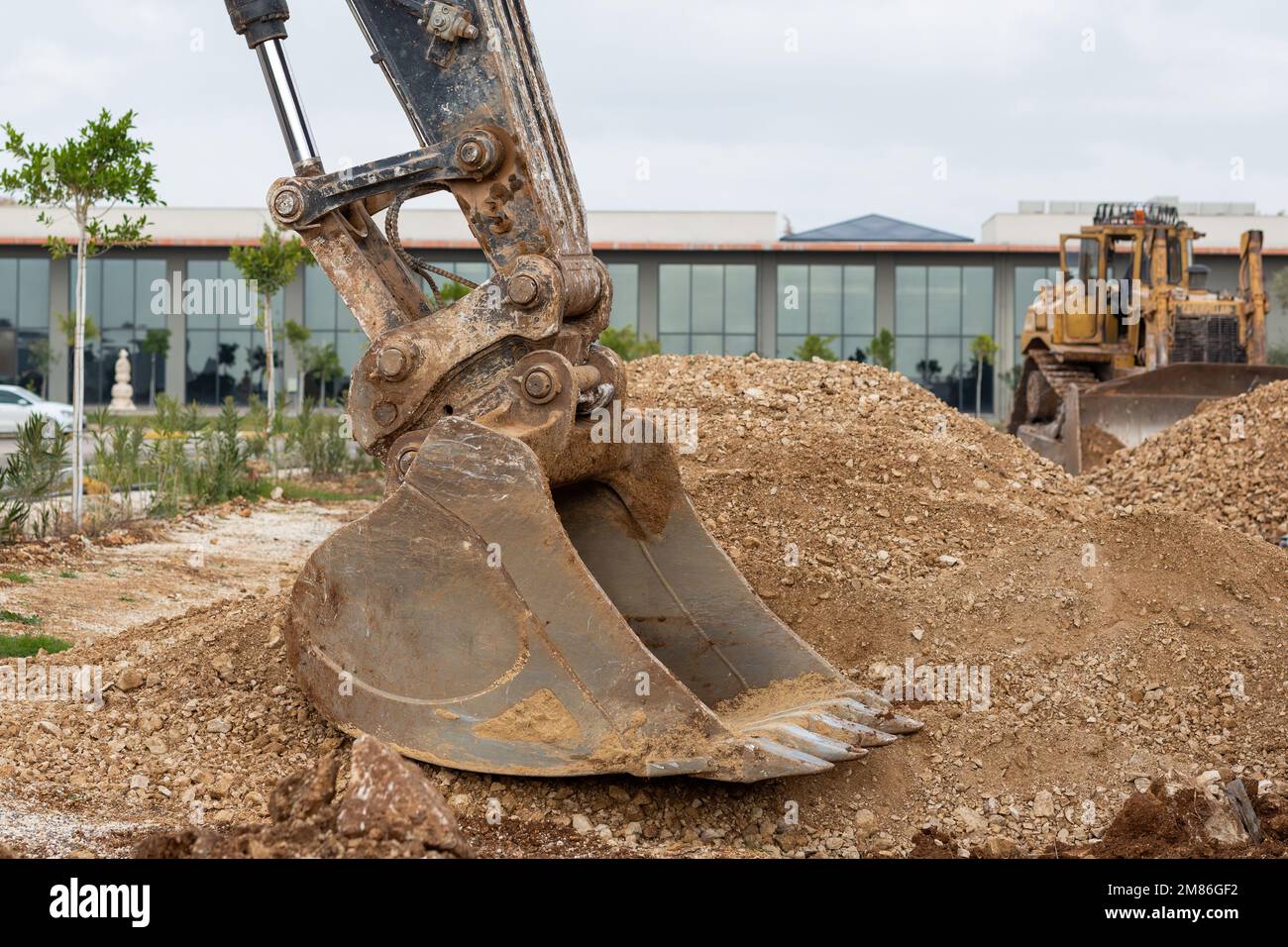 The bucket of a construction machine working in the mud. Excavator ...