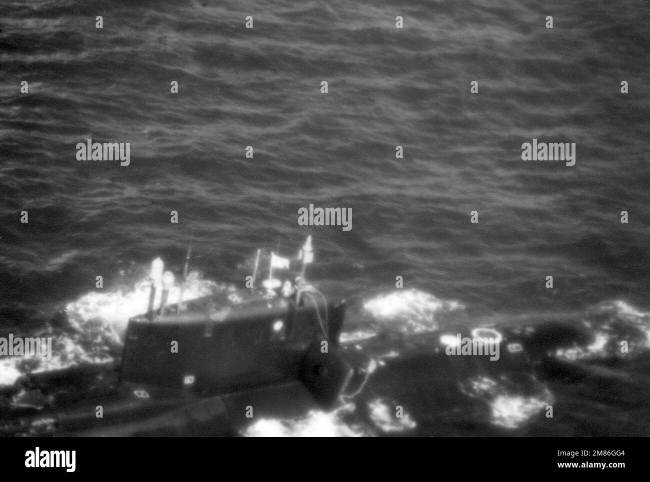 An aerial starboard amidships view of a damaged Soviet Yankee class ...