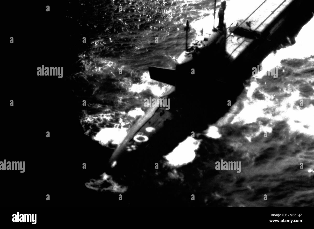 An aerial port bow view of a damaged Soviet Yankee class nuclear ...