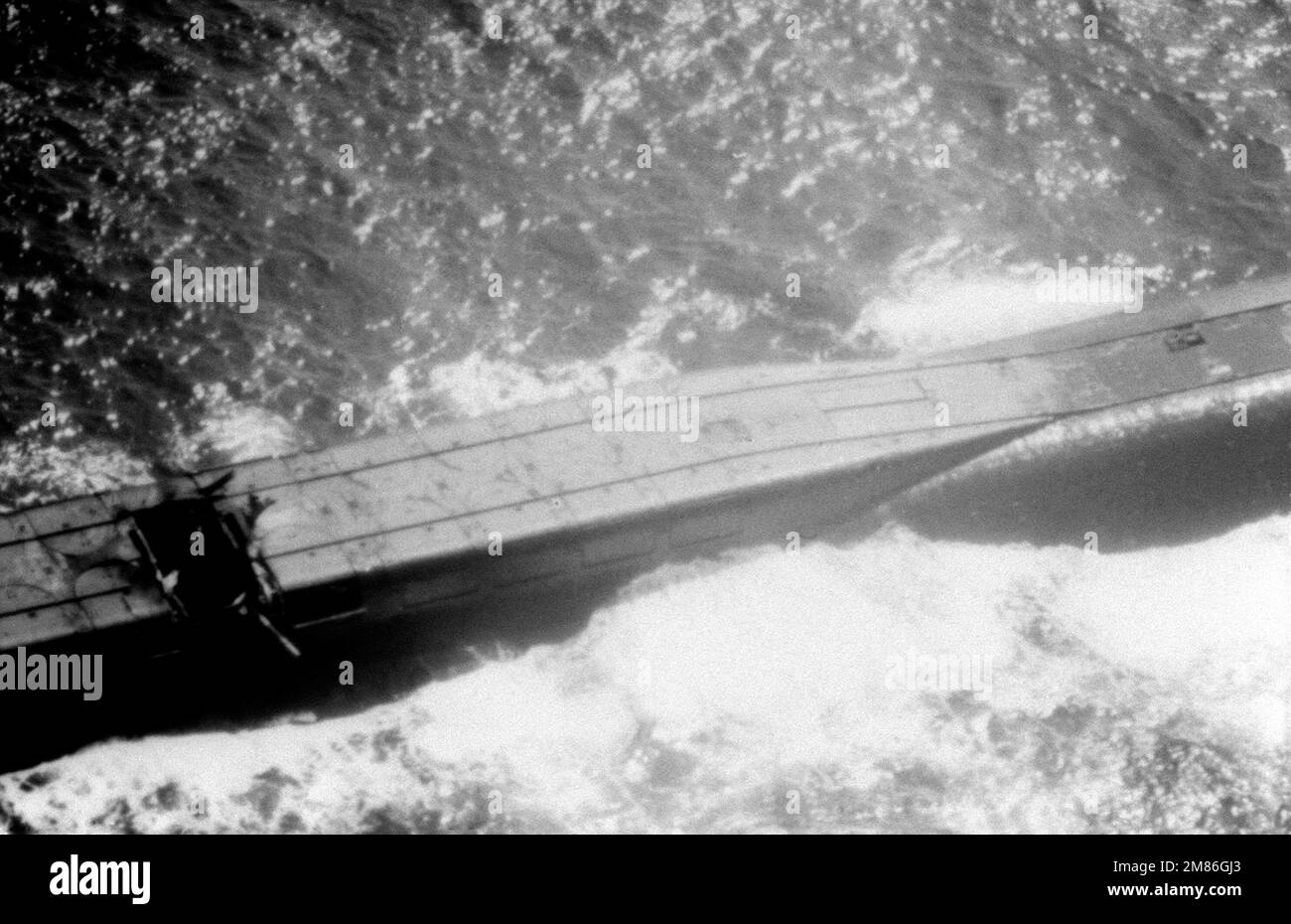 An aerial port amidships view of a damaged Soviet Yankee class nuclear ...
