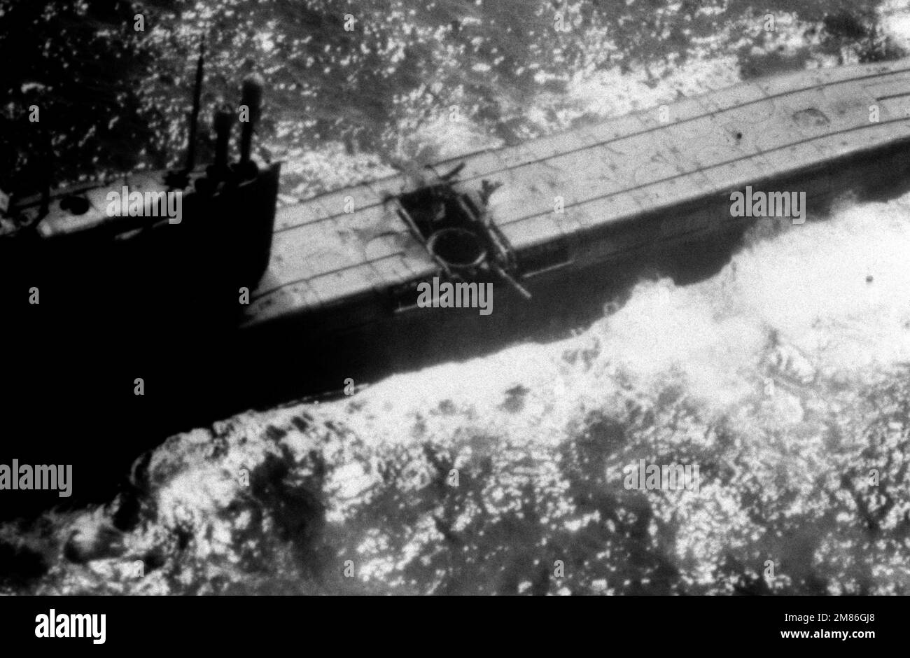 An aerial port amidships view of a damaged Soviet Yankee class nuclear ...