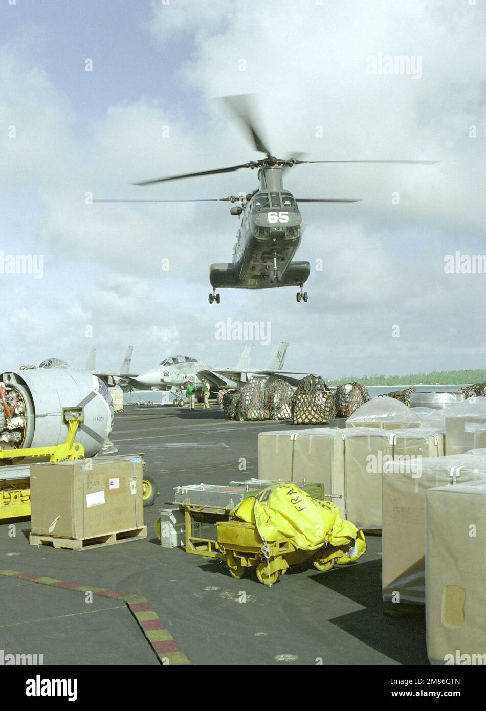 A CH-46 Sea Knight helicopter takes off after transporting supplies to ...