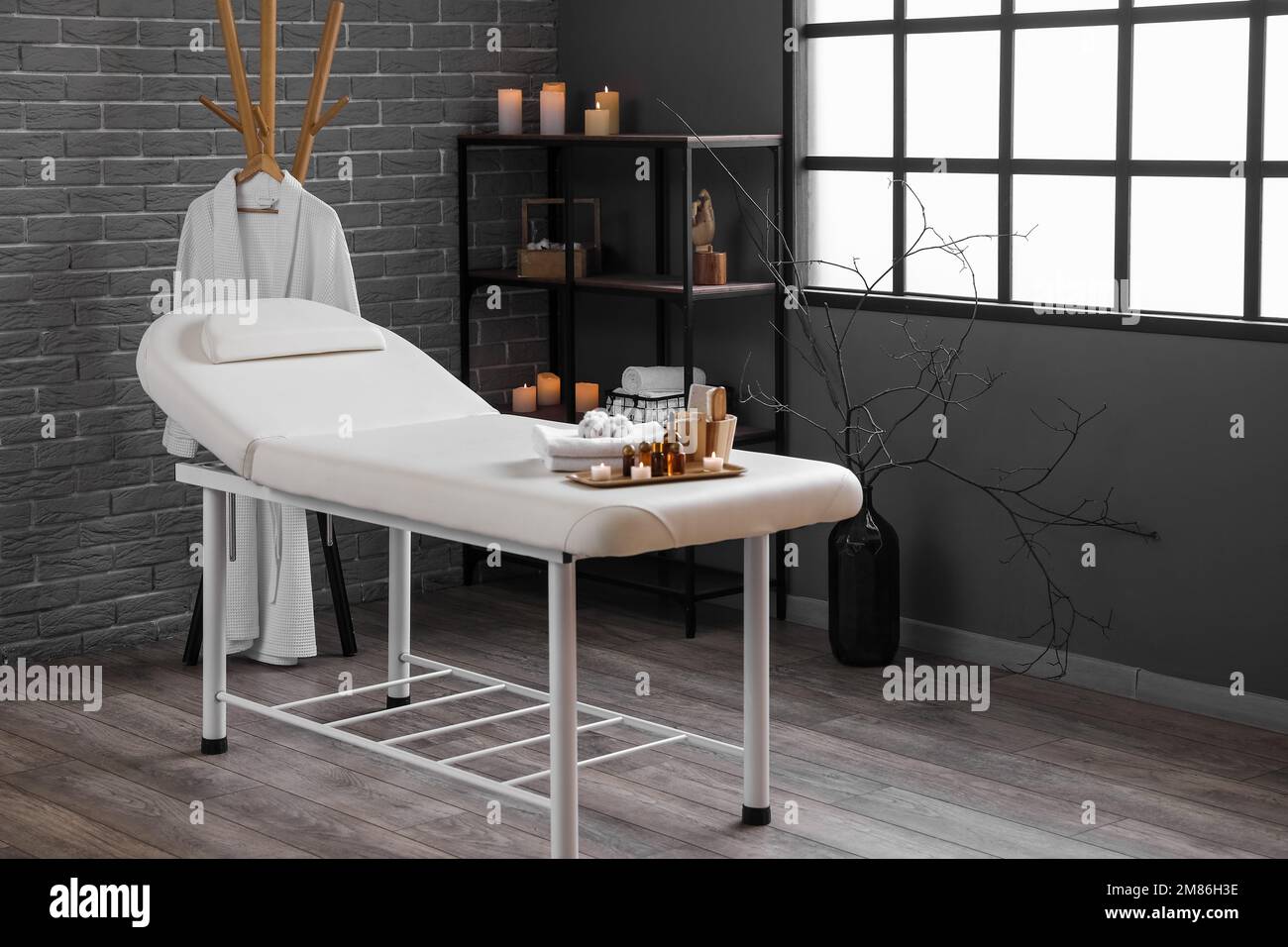 Interior of spa salon with couch, shelving unit and bathrobe Stock ...