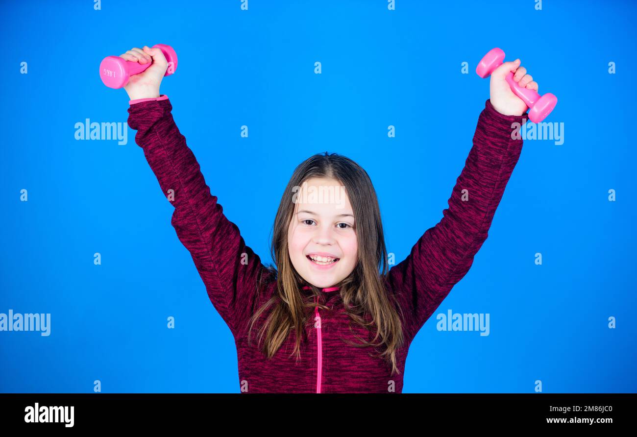 weight lifting for muscules. Childhood activity. Happy athletic child ...