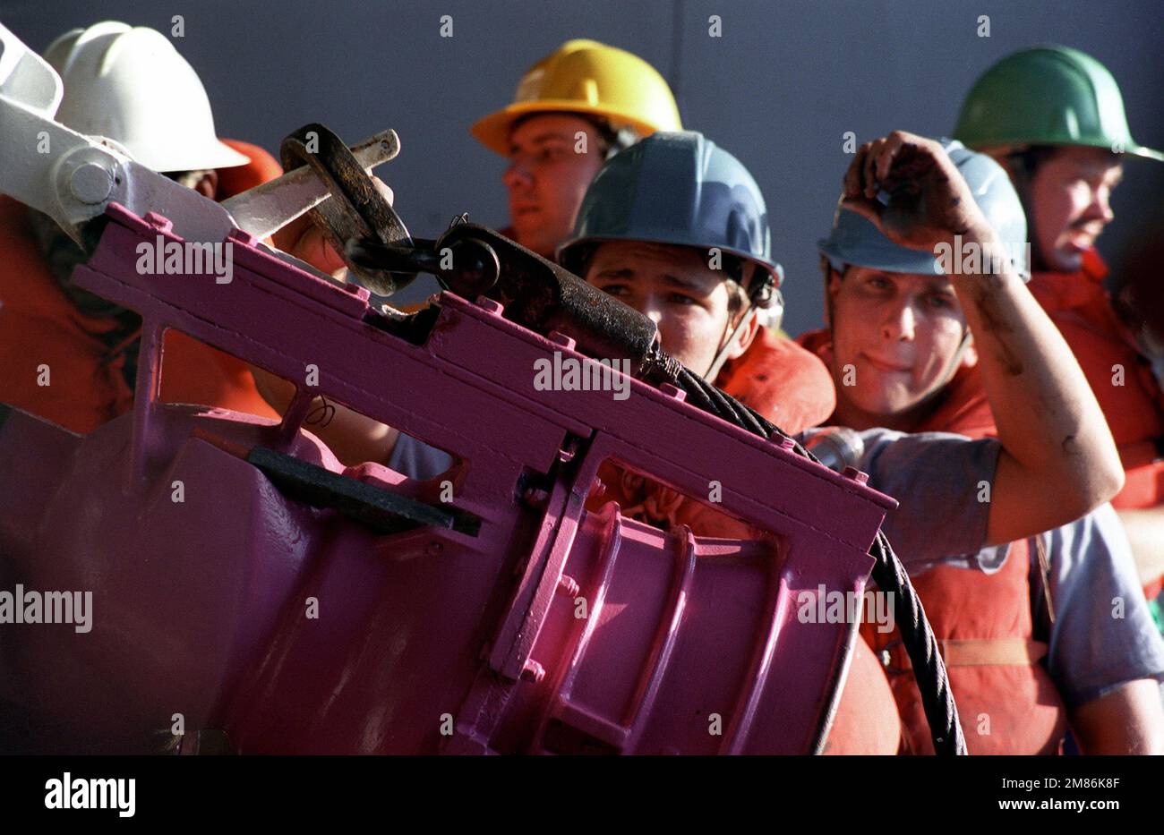 Crew members stand by to receive a refueling probe during an underway ...