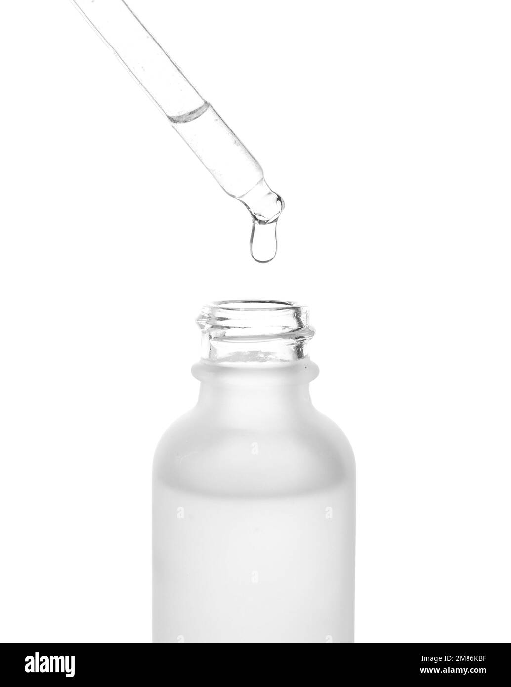 Dripping of serum from pipette into bottle on white background, closeup ...