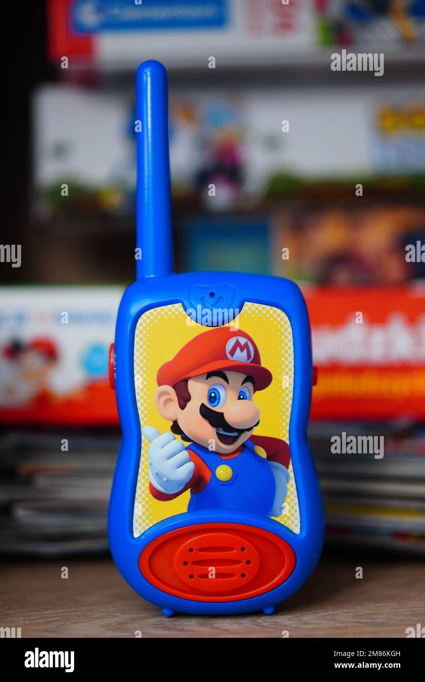 A soft focus of a blue Super Mario plastic walkie talkie toy for ...