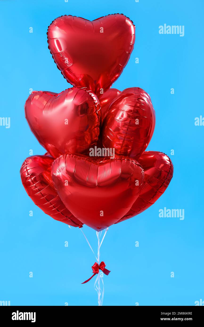 Heart-shaped balloons for Valentine's Day on blue background Stock ...