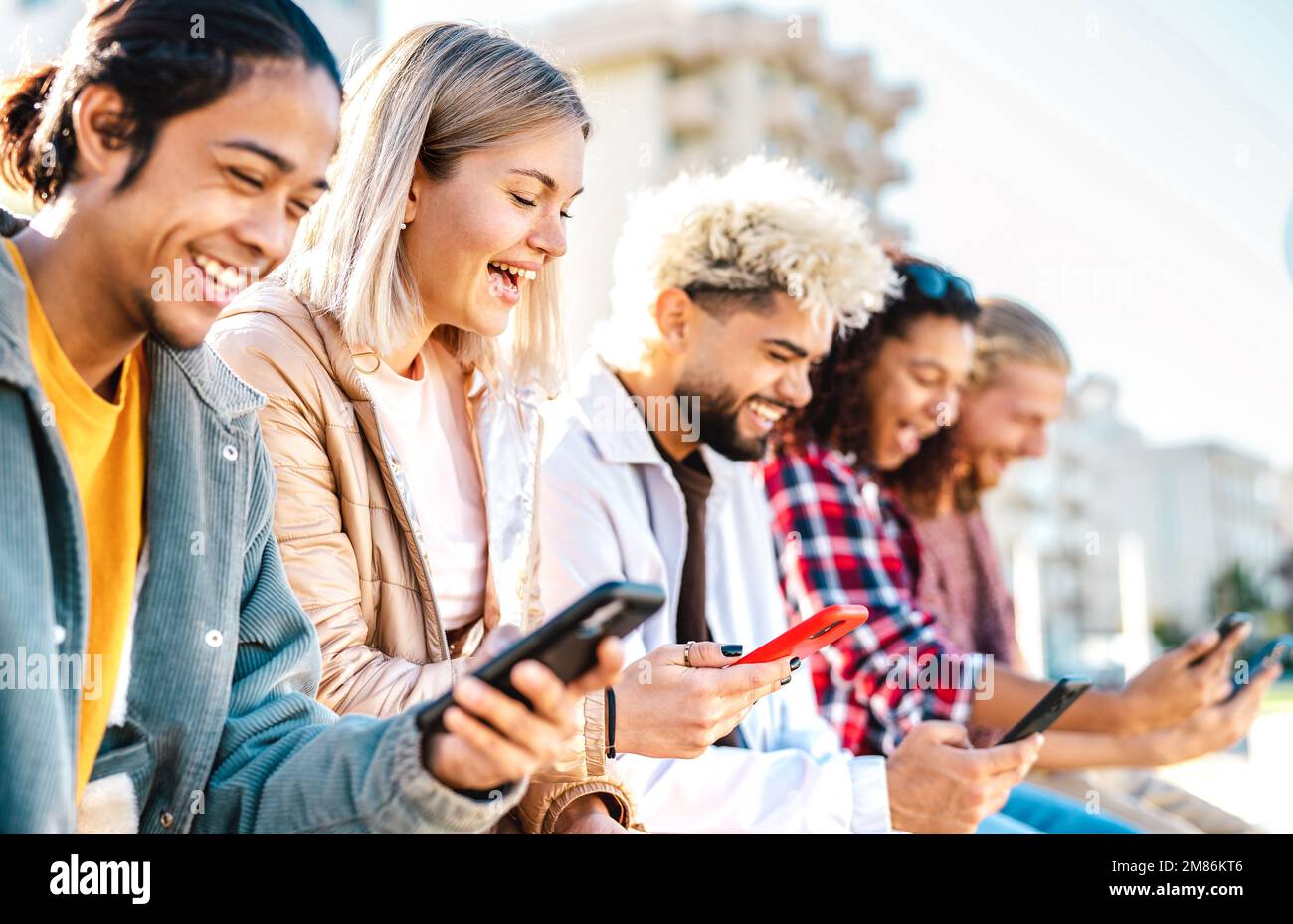 Trendy millenial friends using smartphone at campus college - Young ...