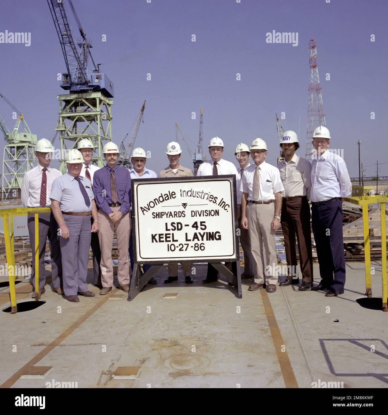 Shipyard and Navy personnel pose for a photo during the keel laying of ...