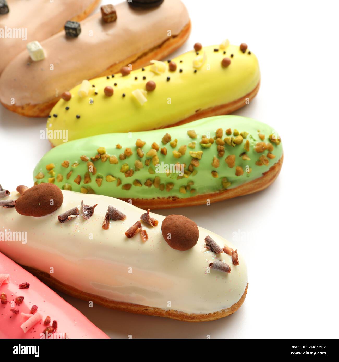 Various glazed eclairs isolated on white background Stock Photo - Alamy