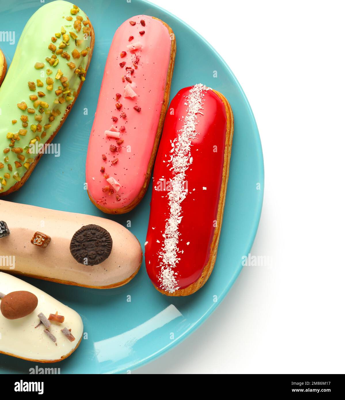 Plate with various glazed eclairs isolated on white background Stock ...