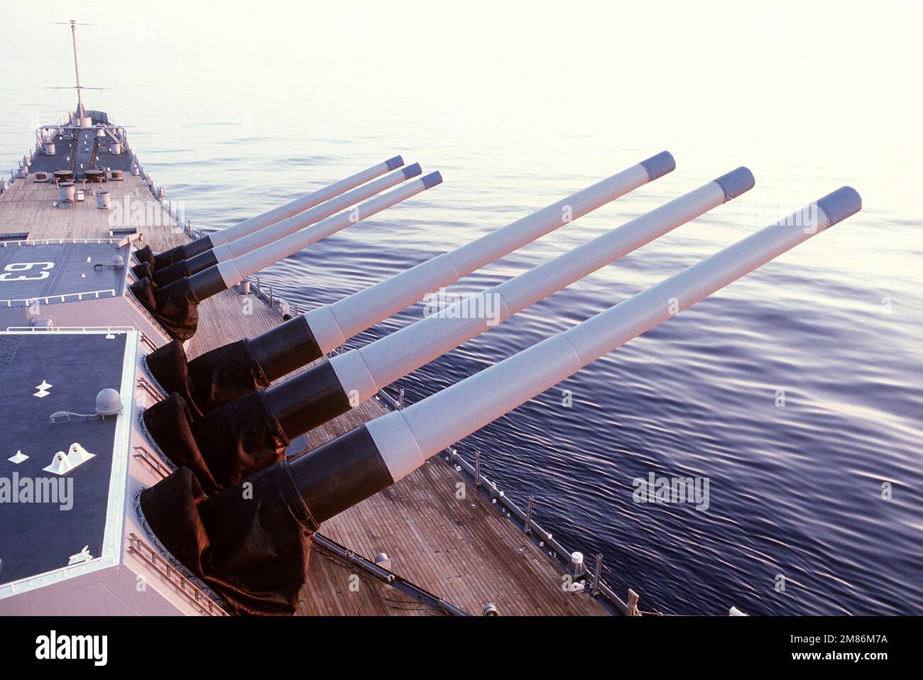 The Nos. 1 and 2 Mark 7 16-inch/50-caliber gun turrets are trained to ...