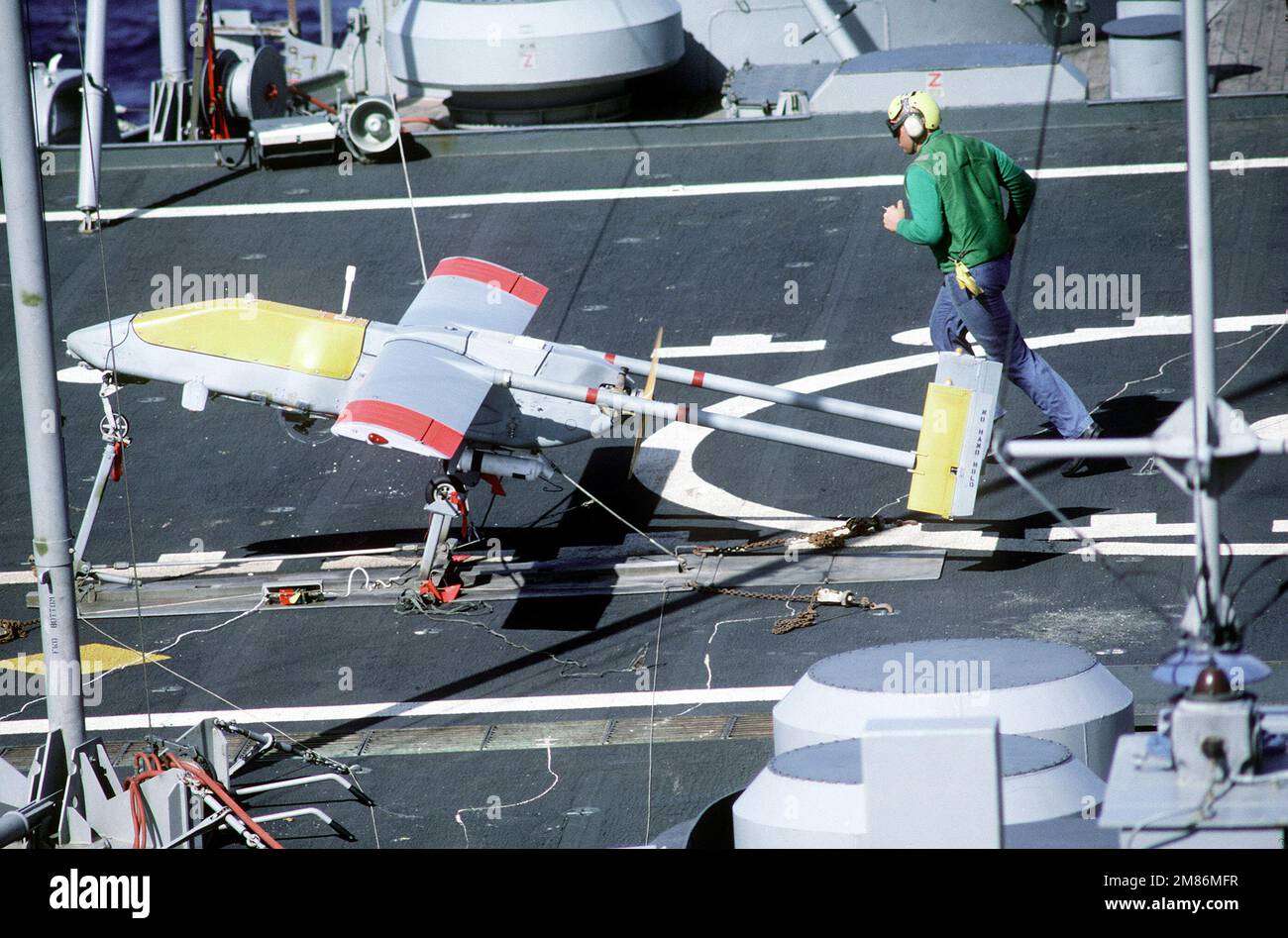 A crewman performs a final pre-launch check on a Pioneer I remotely ...