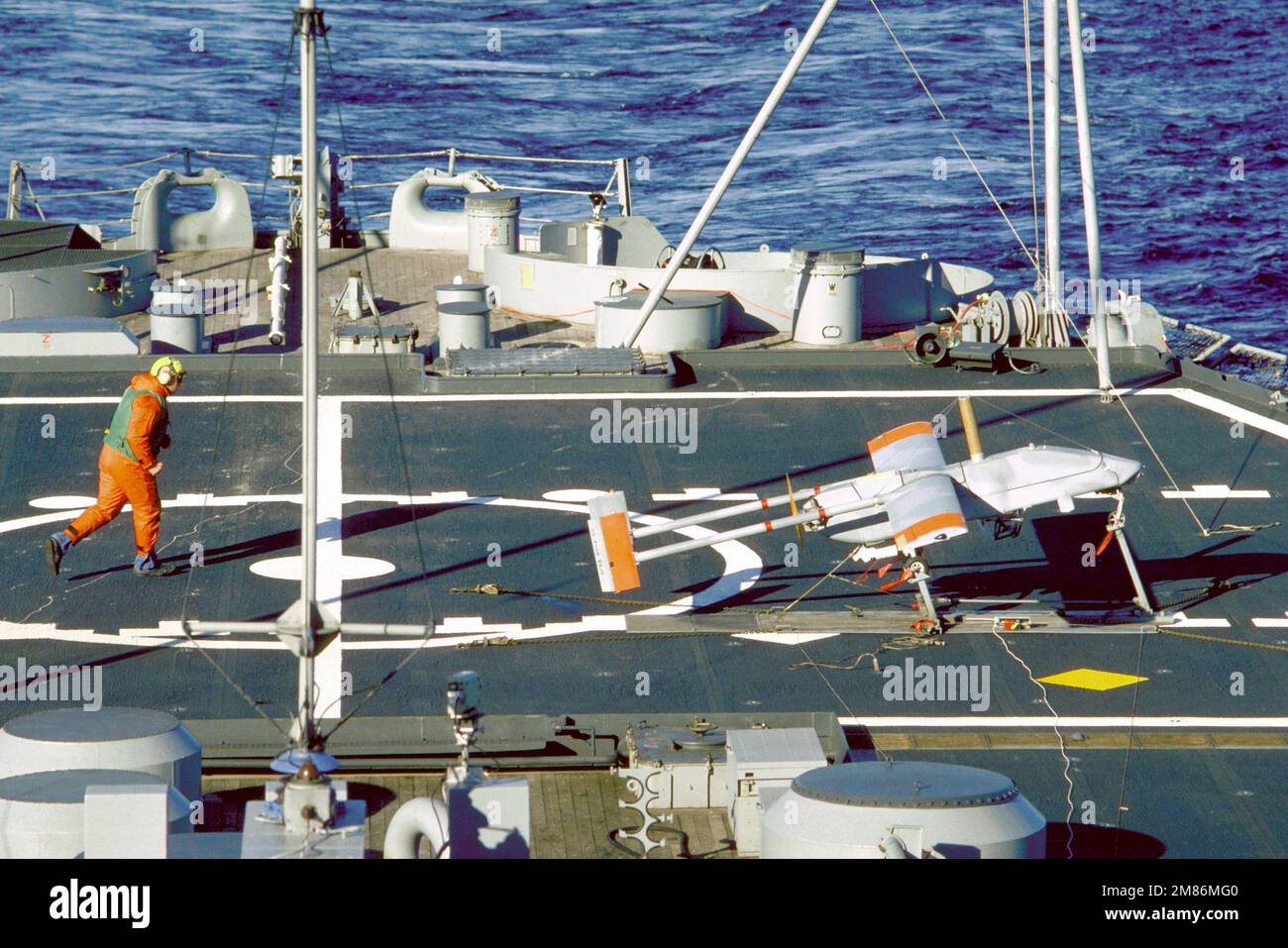 A crewman performs a final pre-launch check on a Pioneer I remotely ...