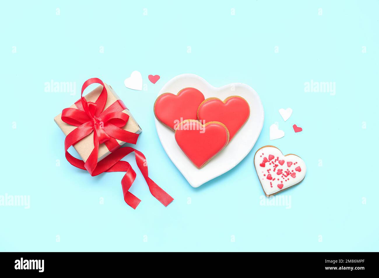 Composition with tasty heart shaped cookies and gift box on color ...