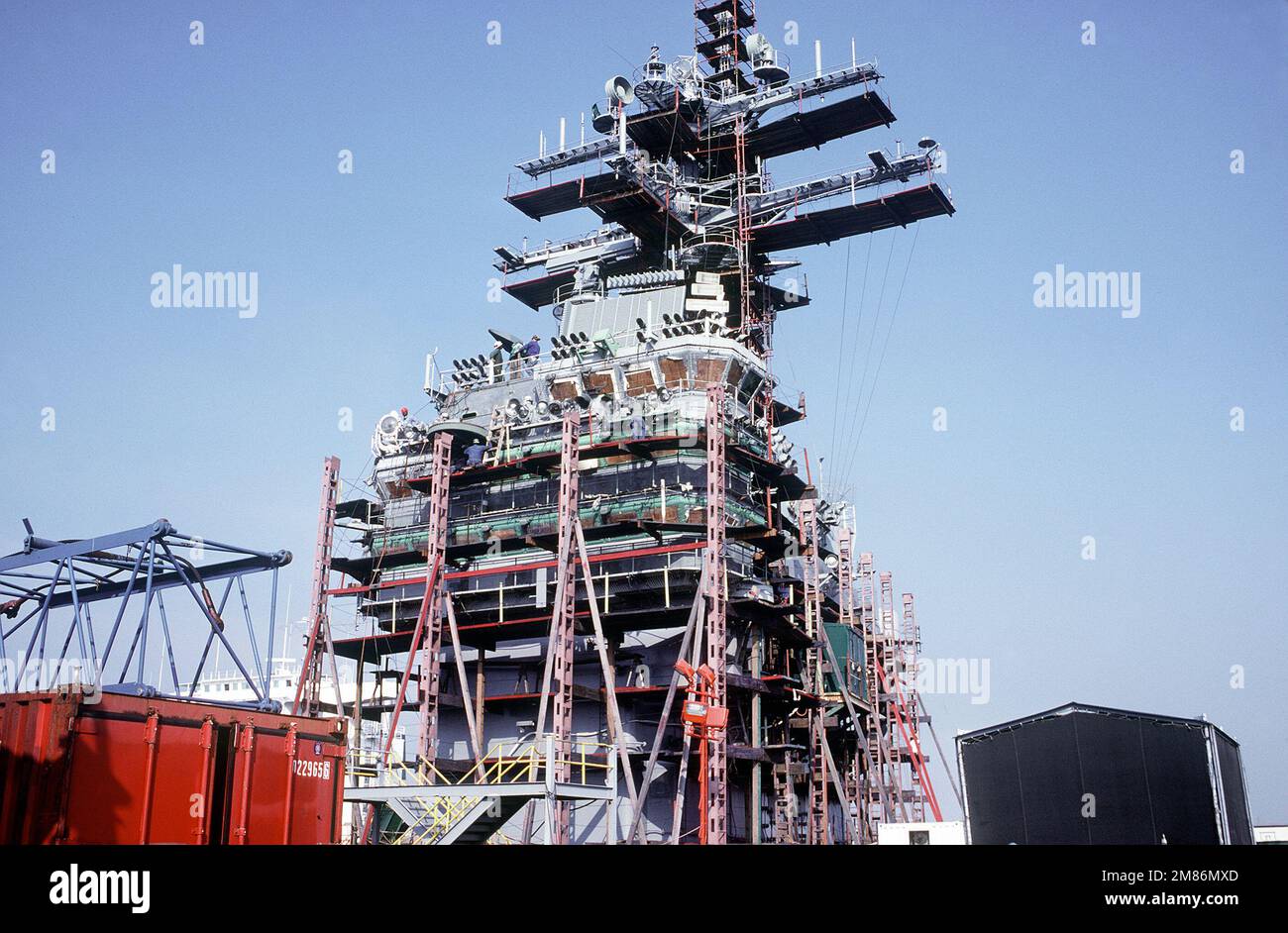Scaffolding surrounds the superstructure of the nuclear-powered aircraft carrier USS DWIGHT D ...