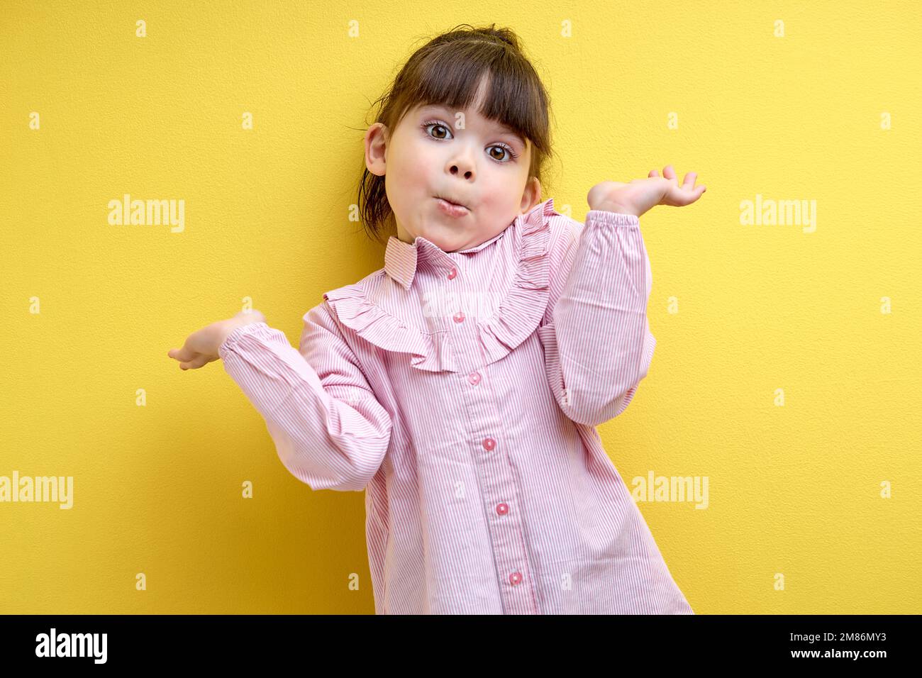 misunderstanding child girl shrugging, i don't know concept. isolated ...