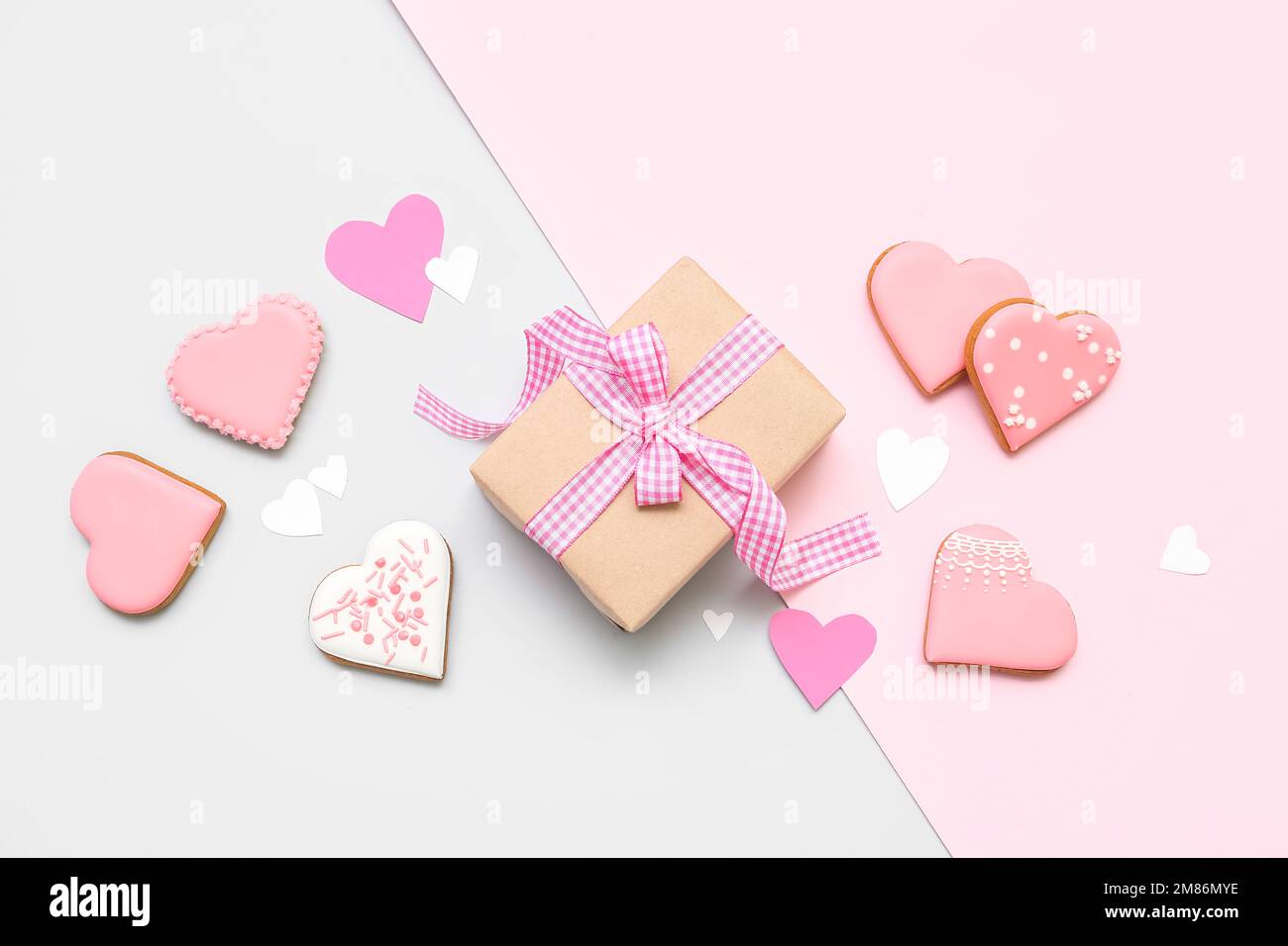 Composition with tasty heart shaped cookies and gift box on color ...
