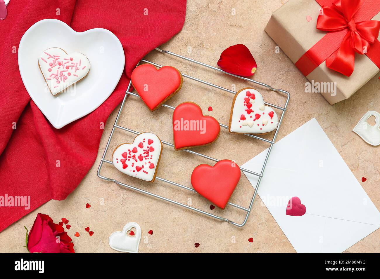 Composition with tasty heart shaped cookies, gift box and envelope on ...