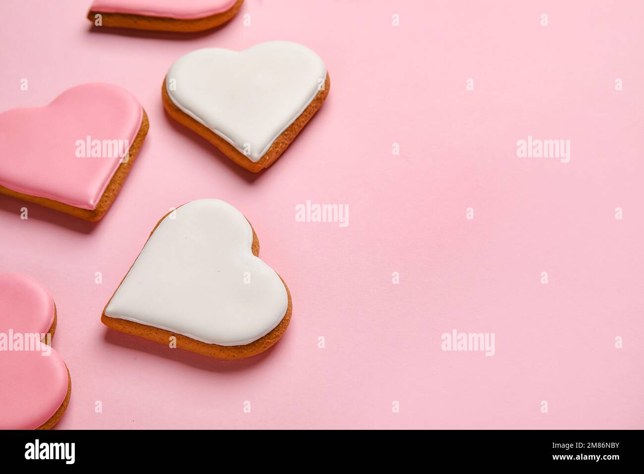 Different heart shaped cookies on pink background, closeup. Valentines ...