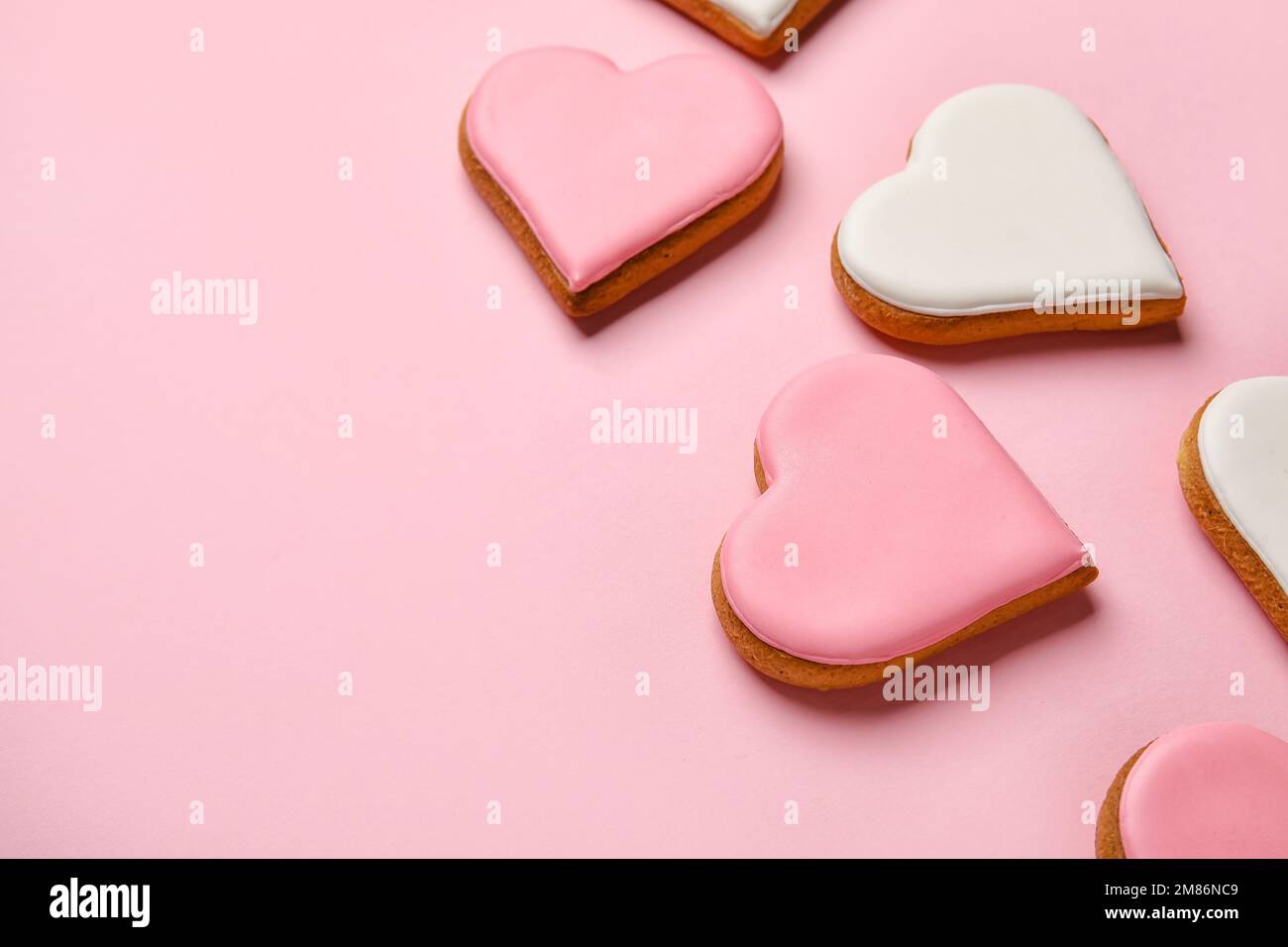 Different heart shaped cookies on pink background, closeup. Valentines ...