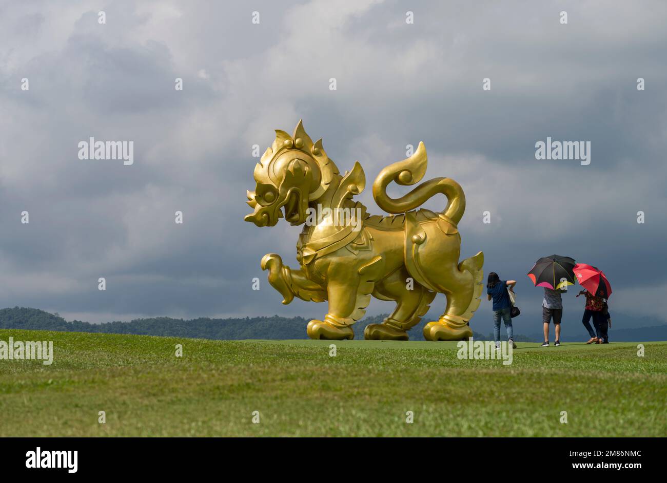 Chiang Rai, Thailand. November 18, 2022. Singha statue at Singha Park. Thai students visiting ...