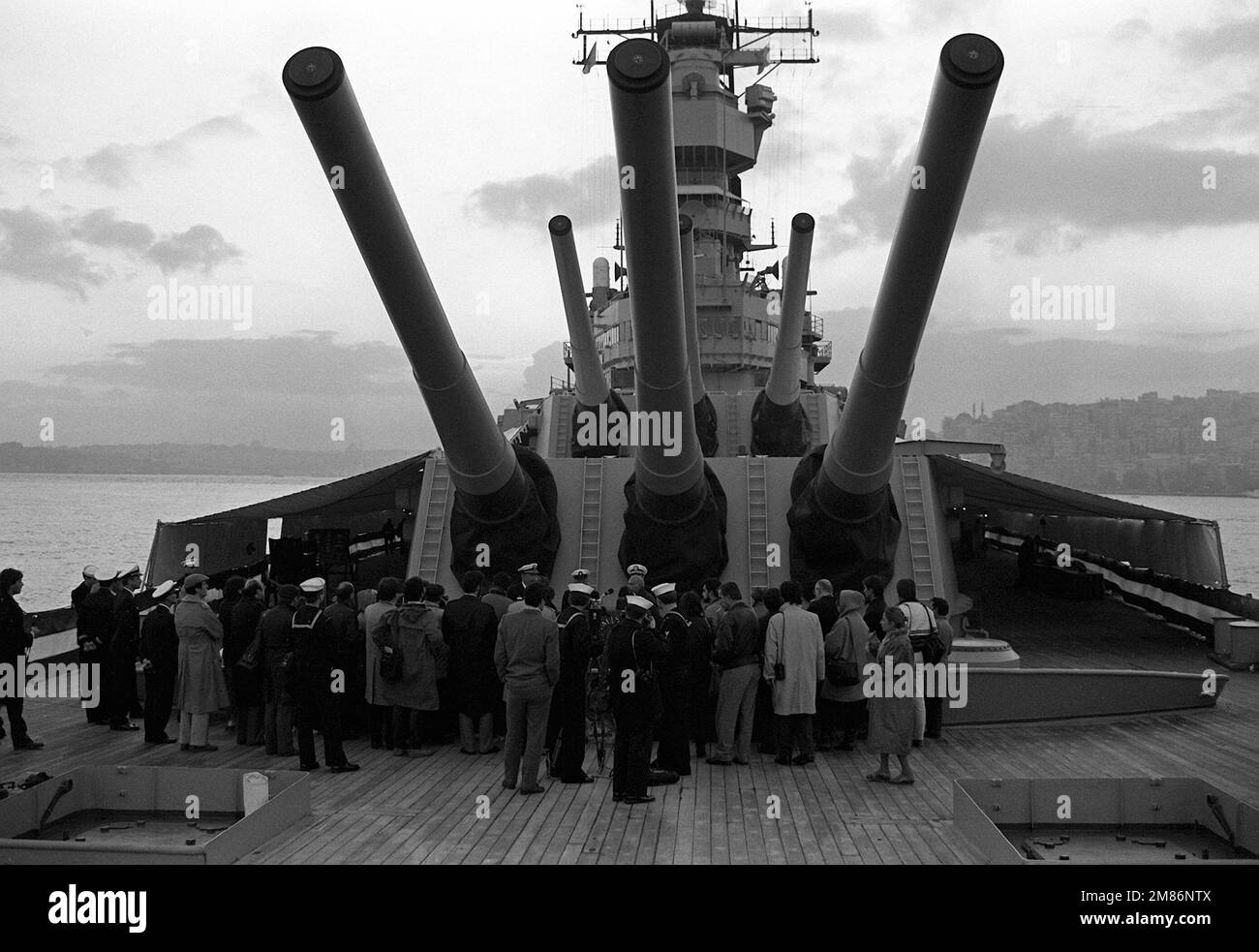 Distinguished guests gather beneath the No. 1 Mark 7 16-inch/50-cal ...