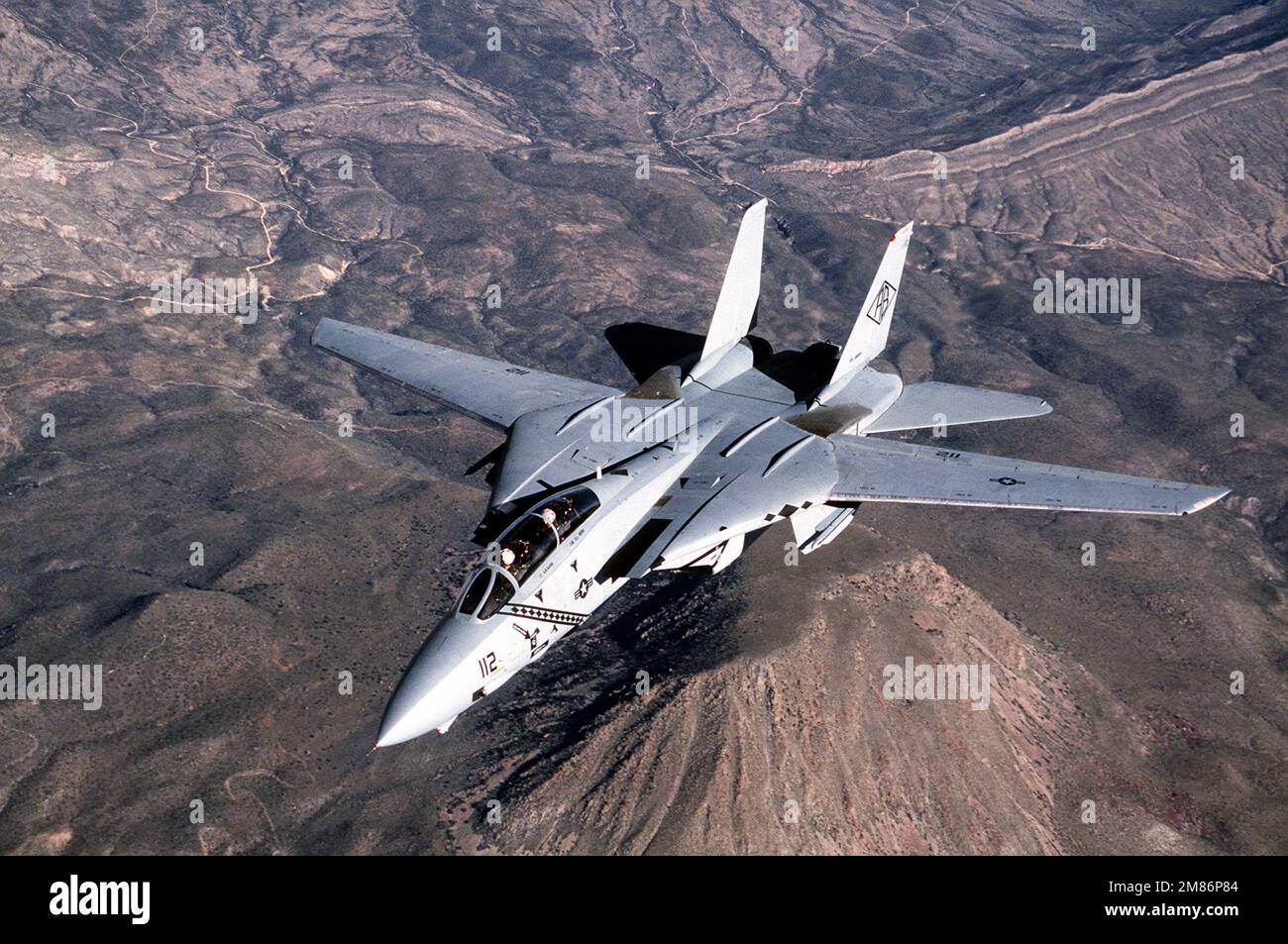 An overhead air-to-air view of a Fighter Squadron 102 (VF-102) F-14A ...