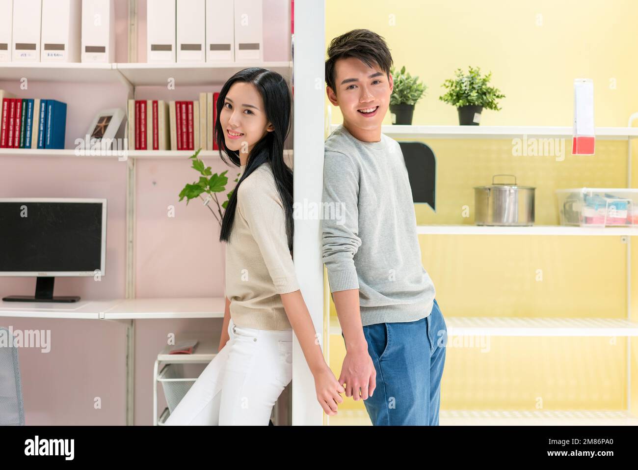 Young lovers back-to-back Stock Photo - Alamy