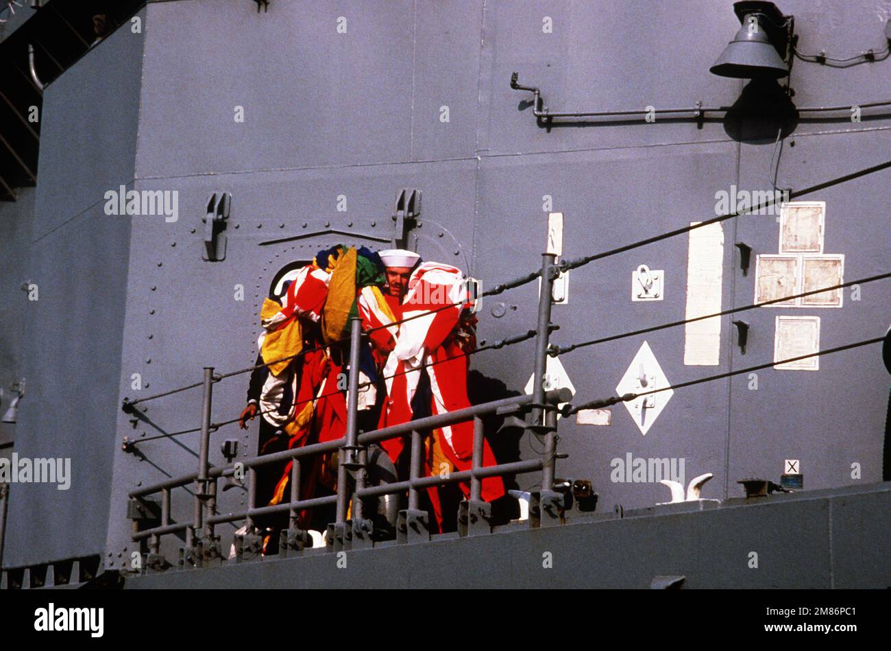 A signalman aboard the guided missile cruiser USS REEVES (CG-24 ...
