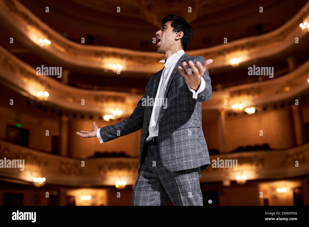 Portrait of talented attractive singer in elegant classic outfit ...