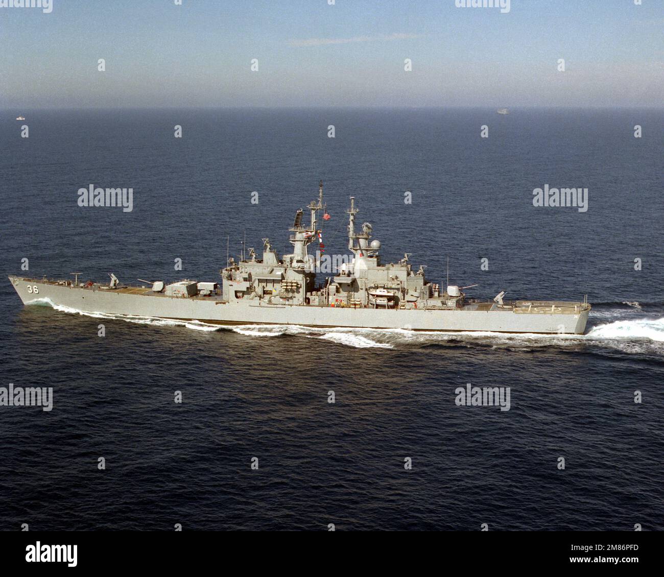 A port beam view of the nuclear-powered guided missile cruiser USS ...