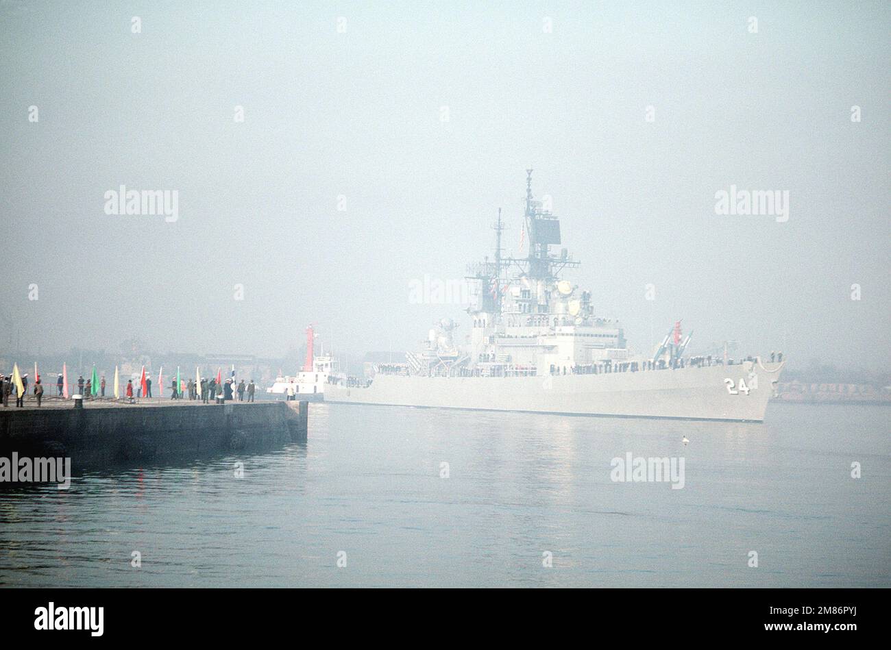 Crew members man the rail of the guided missile cruiser USS REEVES (CG ...