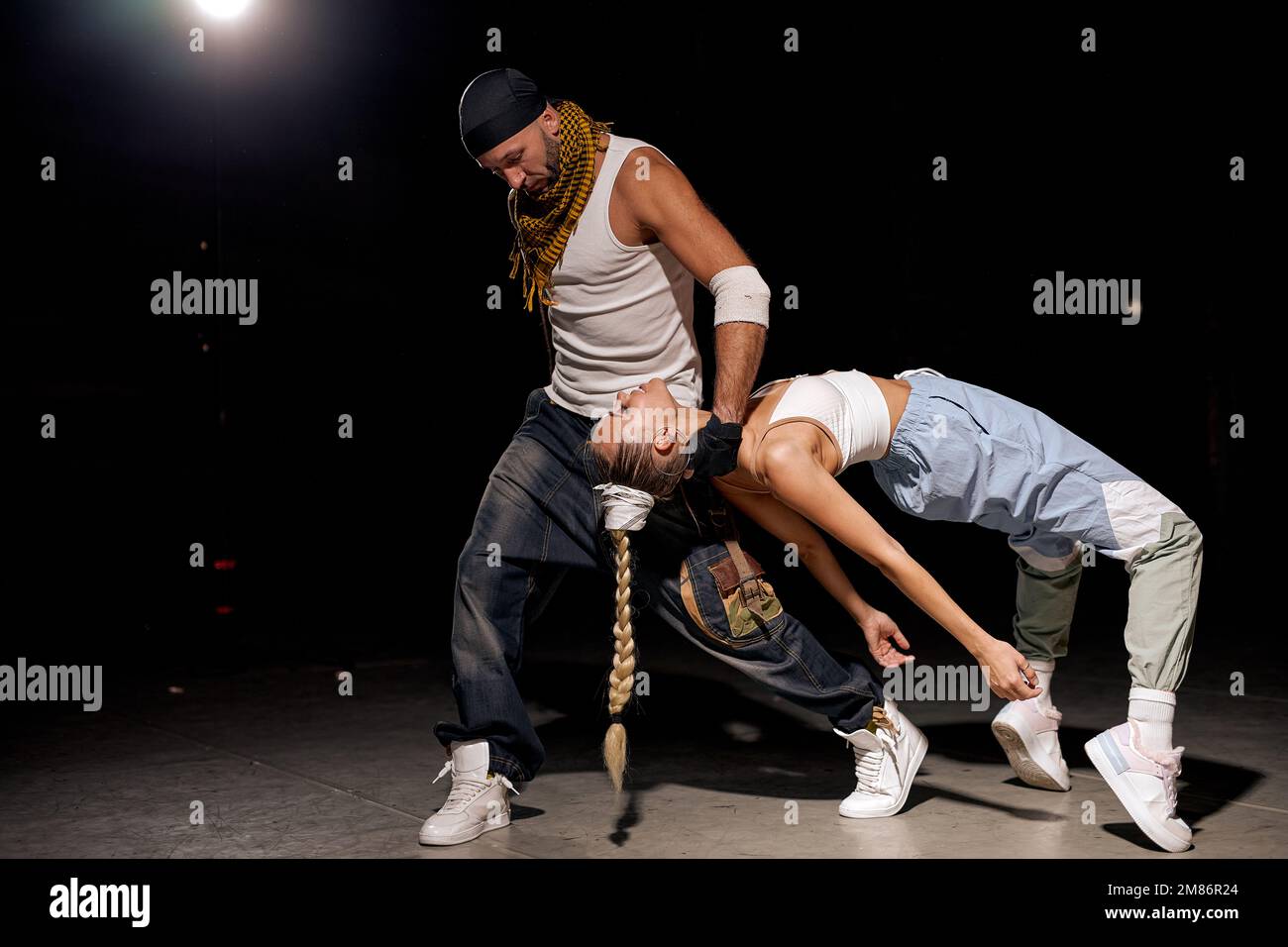 Black and caucasian couple dancing contemporary dance in studio.black ...