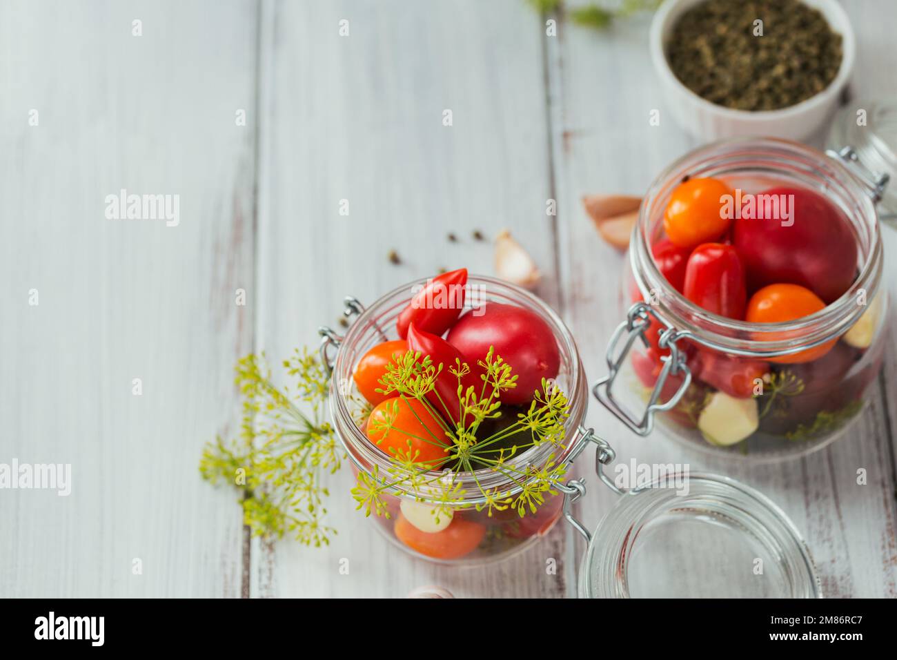 Homemade canning. Ingredient for pickles tomatoes with dill on the ...