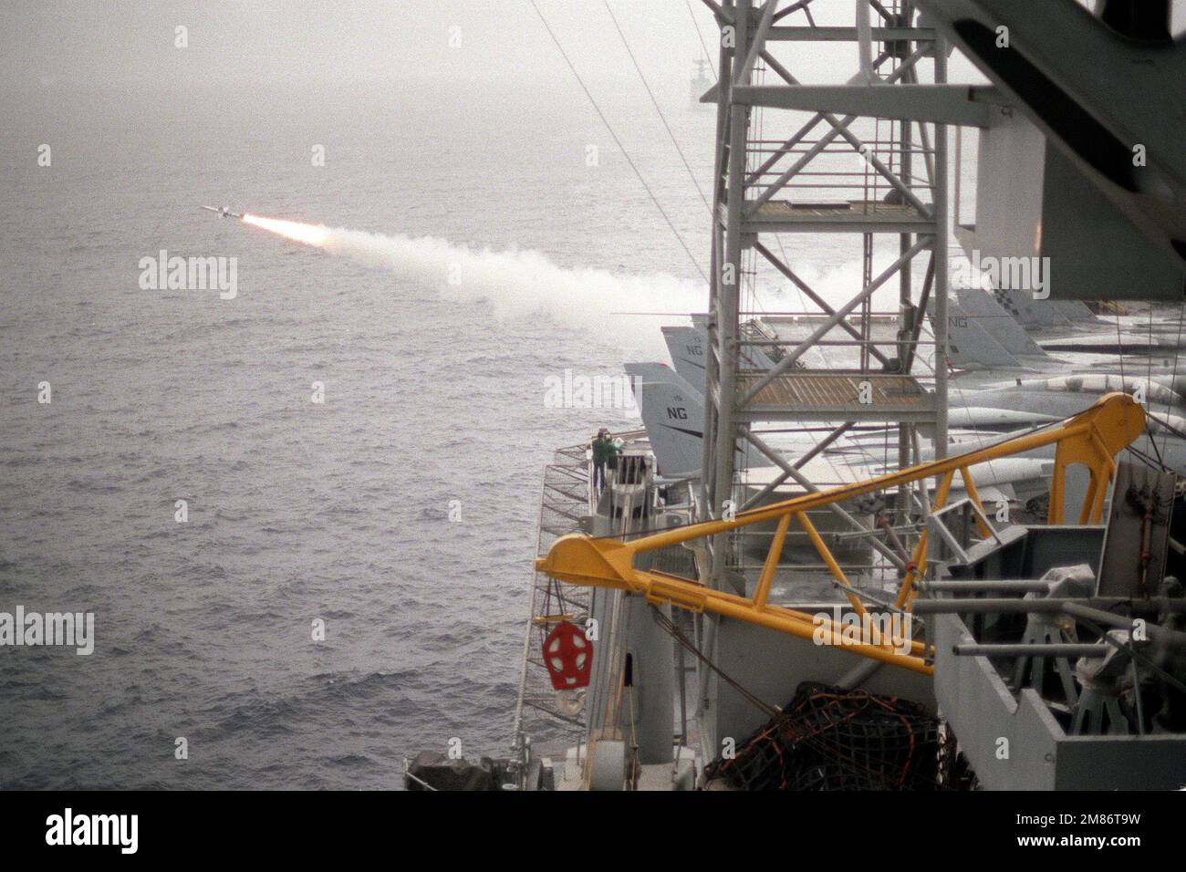 An RIM-7 Sea Sparrow missile is fired from the aircraft carrier USS ...