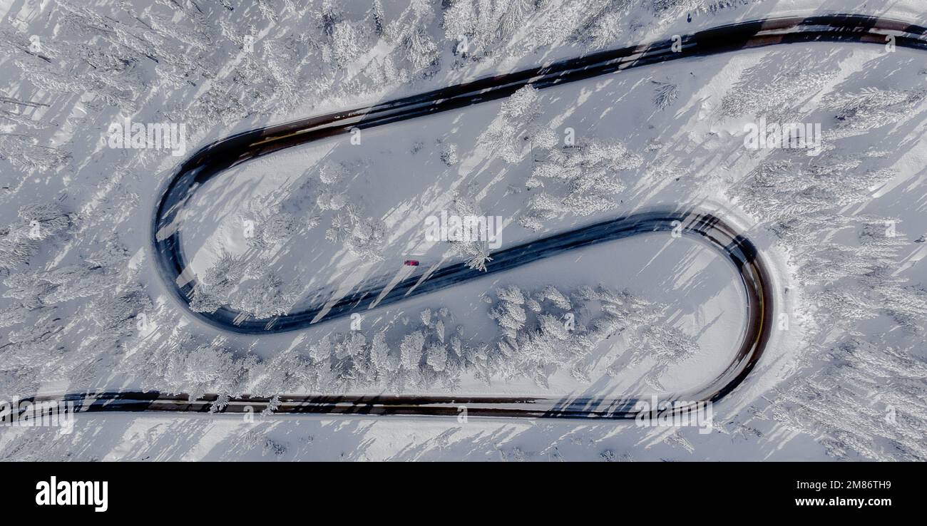 A winding road snakes it's way up the mountain side during the heart of ...