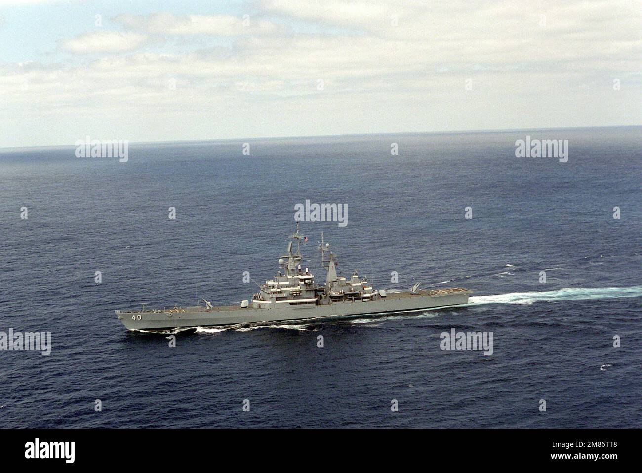 A port bow view of the nuclear-powered guided missile cruiser USS ...