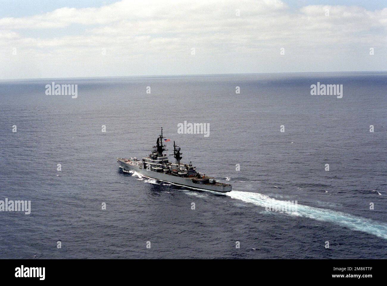 An aerial port quarter view of the guided missile cruiser USS ...