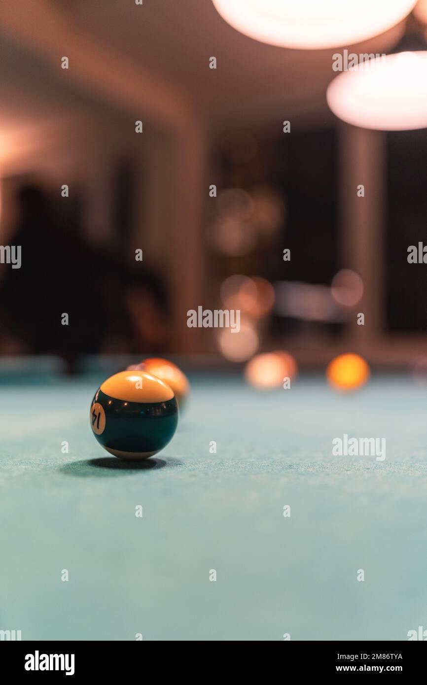 A vertical selective shot of a billiard ball on the pool table Stock ...