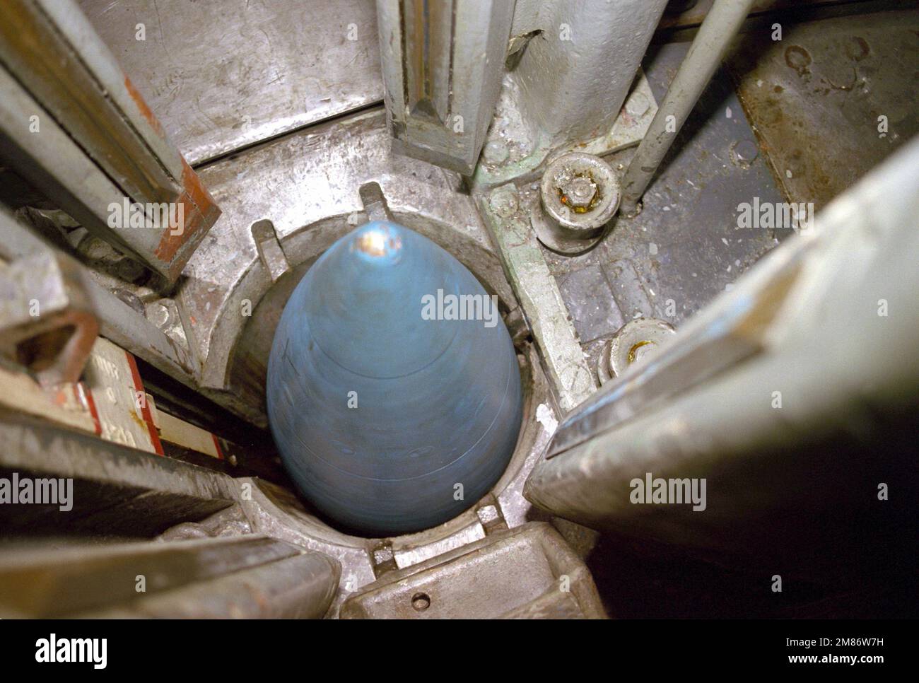 As seen from above, a 2,700-pound dummy projectile travels up a hoist ...