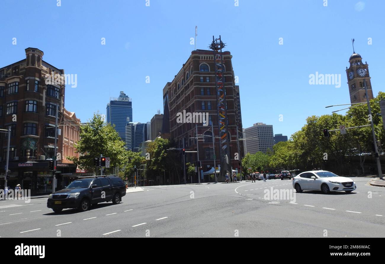 An urban view of cars on the streets of Sydney surrounded by ...