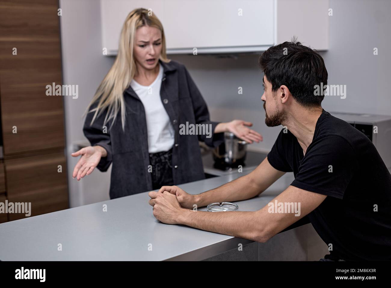 Young Caucasian Couple Have Disagreement in Kitchen at Home. Quarrel in ...